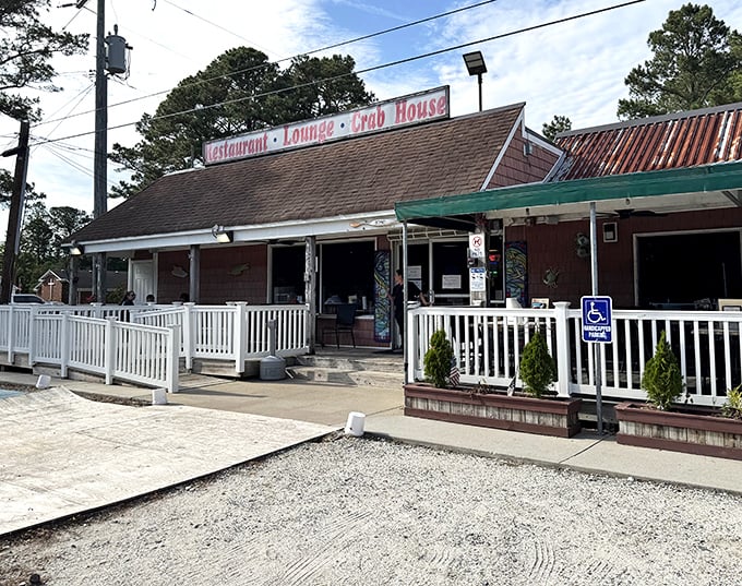 Rustic charm, seafood farm! Margie & Ray's weathered roof and white porch railing welcome you to crab paradise.