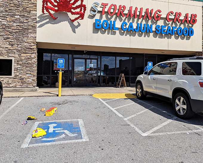 Storming Crab's bold red crustacean sign isn't just announcing a restaurant—it's warning you that a delicious seafood hurricane is about to hit!