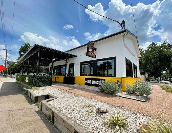 La Barbecue's bright white building with sunny yellow trim feels like a party. The sign doesn't lie—that line is definitely worth joining.