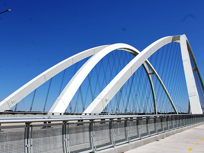Moline's modern bridge arches gracefully across the Mississippi. Engineering that's both functional and beautiful—a rare combination these days!
