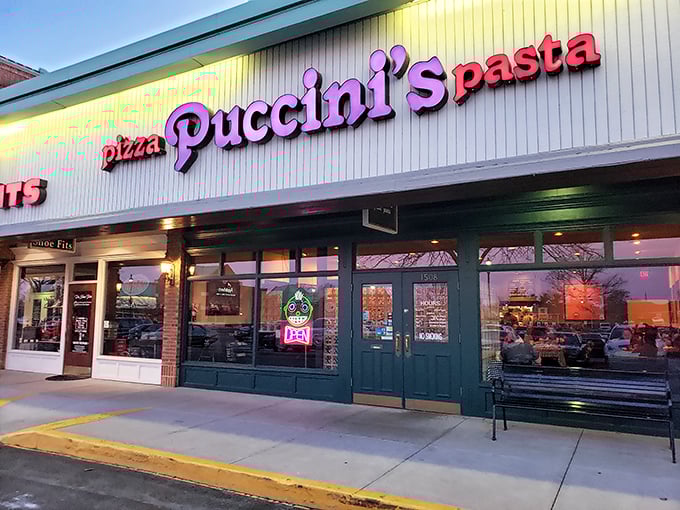 Evening at Puccini's – when the glowing sign beckons pasta and pizza lovers to indulge in Italian-inspired delights.