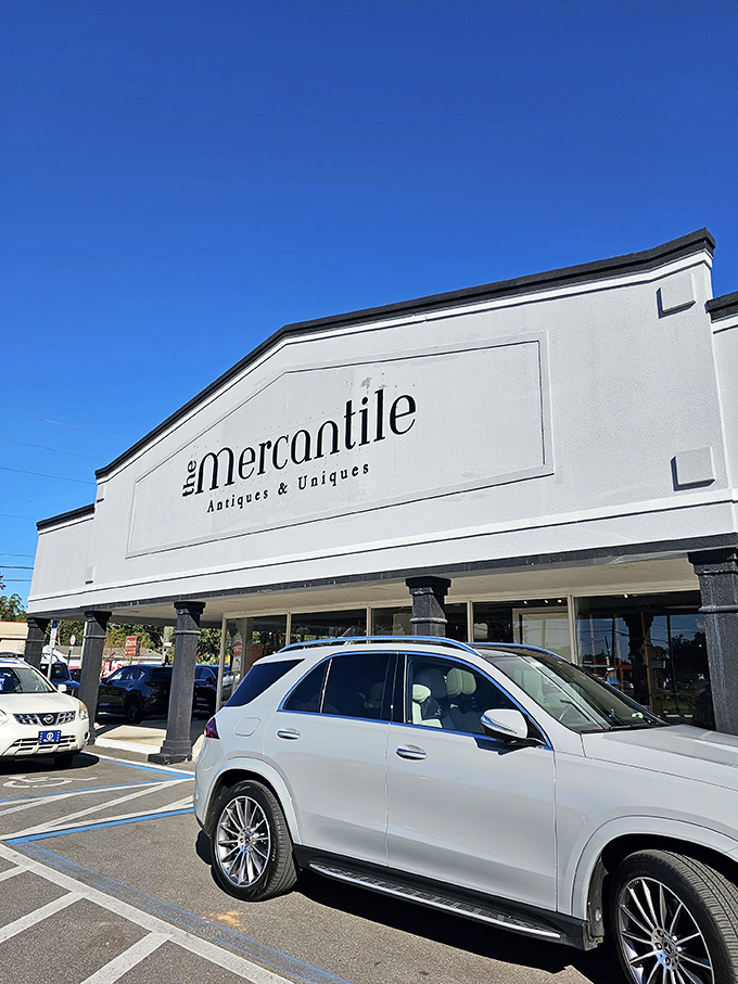 A clean, open exterior and ample parking — the ideal setup for Florida antique hunters outside The Mercantile.