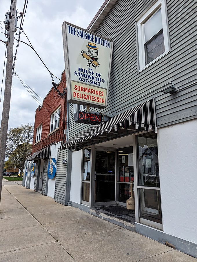 That vintage sign for The Sausage Kitchen promises submarine salvation. Where sandwich dreams come true without any unnecessary fuss.