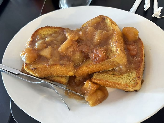 Apple pie French toast—because sometimes breakfast should taste like dessert. The cinnamon-apple topping makes syrup completely unnecessary but entirely welcome.