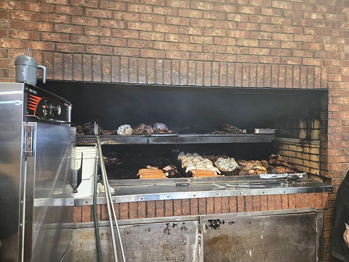 The pit where magic happens. Like watching Michelangelo paint, except with meat and fire instead of cherubs and ceilings.