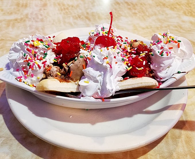 The banana split at Mayfair doesn't whisper "dessert"—it shouts it with sprinkles, cherries, and enough whipped cream to make your dentist wince.