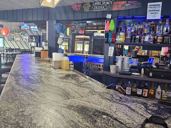 The bar area balances rustic charm with lakeside functionality – the kind of place where strangers become friends over stories of "the one that got away."