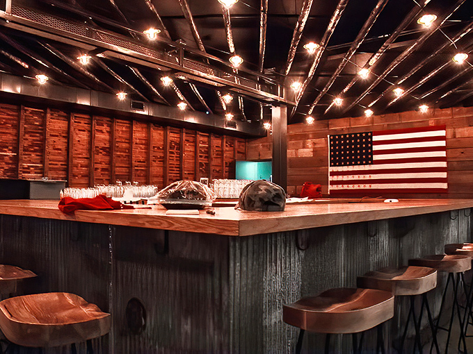 The bar at Walter's doesn't just serve drinks—it serves Americana, complete with wooden stools and an actual American flag.