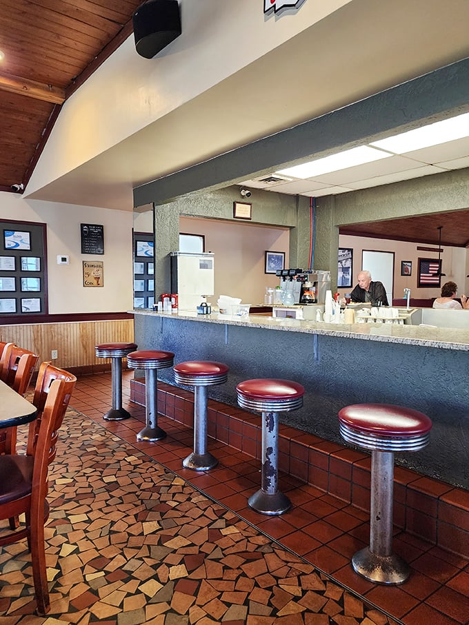 Counter seats: where solo diners become regulars and servers remember your coffee preference better than your own children do.