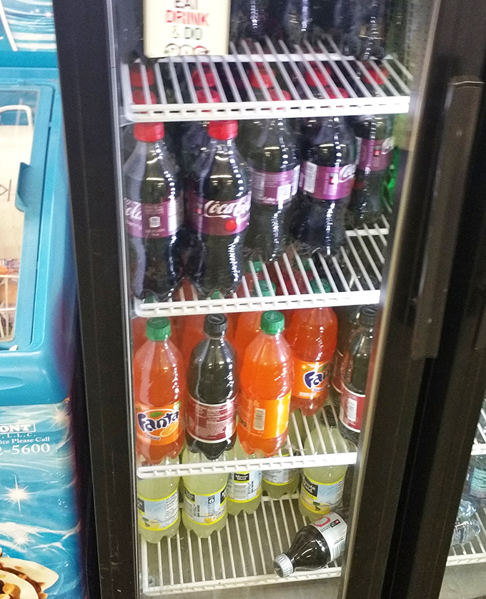 The refrigerated beverage section: salvation on scorching Madison summer days. Fanta orange – still delivering that same childhood sugar rush decades later.