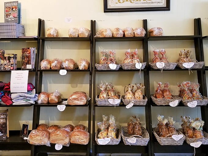 Bread paradise exists, and it's arranged on these shelves. Each loaf and pastry waits patiently, wrapped like the precious gift to humanity that it is.