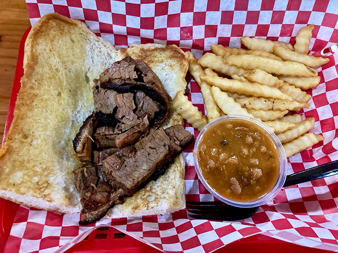 The brisket sandwich – where smoke-kissed beef meets Texas toast in a relationship so perfect it should have its own romance novel.