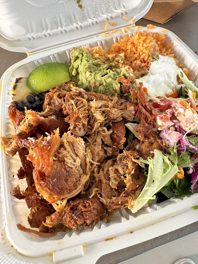 This carnitas platter isn't just a meal—it's a commitment. The kind of food that demands you cancel your next appointment.