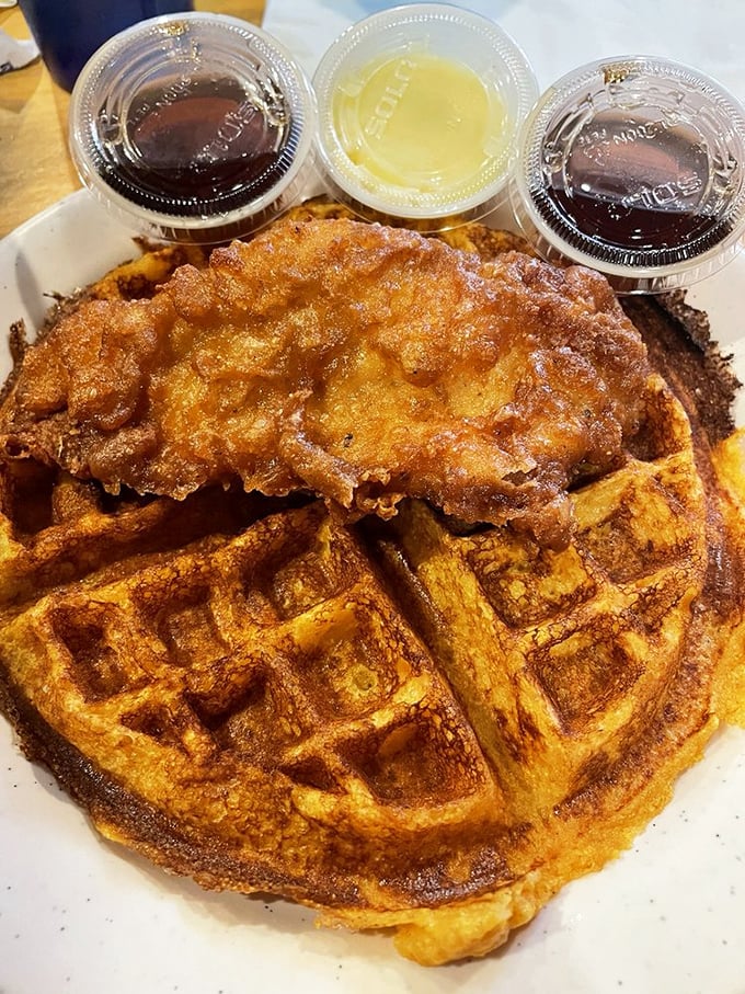 This chicken and waffle situation isn't just breakfast—it's an edible monument to the perfect marriage of sweet and savory.