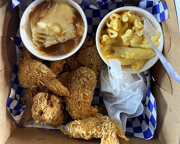 Chicken wings, mac and cheese, and what appears to be peach cobbler—the kind of meal that makes you want to hug the chef.