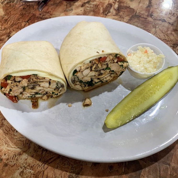 This wrap isn't just stuffed—it's having an existential crisis about containing all that chicken, veggies, and flavor in one tortilla.