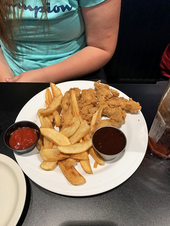 Comfort food doesn't need to apologize for being exactly what it is—crispy chicken tenders and golden fries that satisfy the soul.
