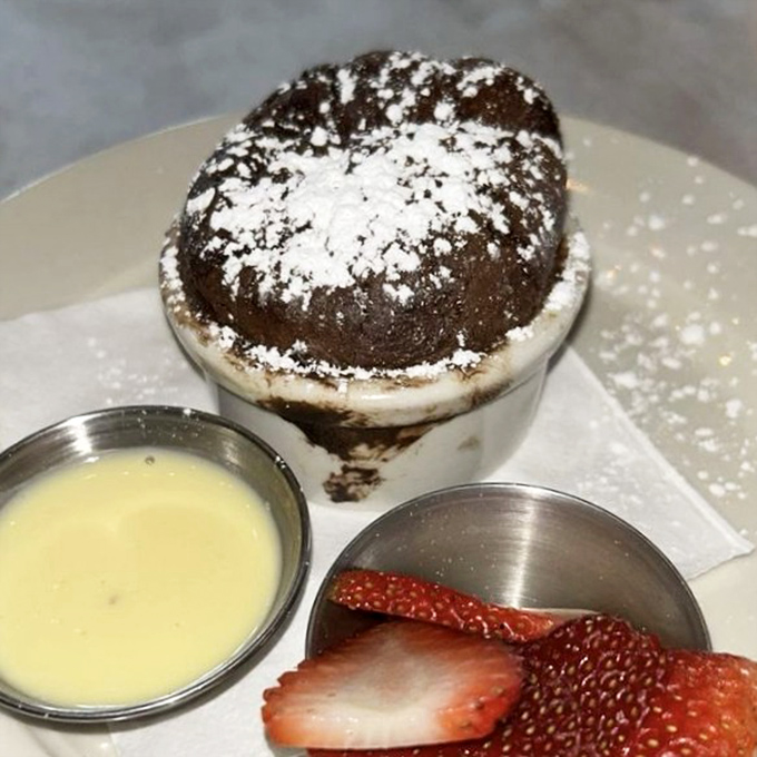 A chocolate soufflé that rises to the occasion, served with crème anglaise and strawberries. Worth the 20-minute wait and every calorie.