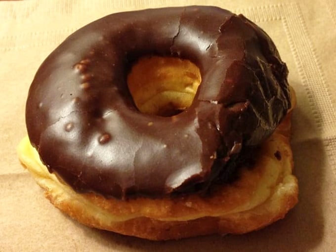 The chocolate raised donut—where physics defies logic as something this substantial somehow manages to feel light as air.