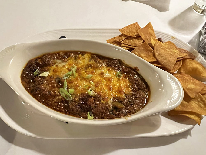 This bubbling cauldron of cheesy goodness with house-made chips is how all great evenings begin – and why belt loops were designed to expand.