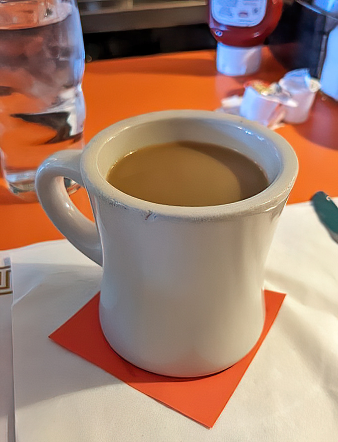 The humble diner coffee mug—sturdy, unpretentious, and filled with liquid motivation. No fancy latte art needed when the coffee speaks for itself.