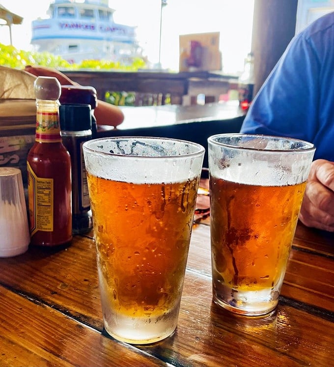 Cold beer in frosted glasses with boats bobbing just beyond—this is what people in offices are daydreaming about right now.