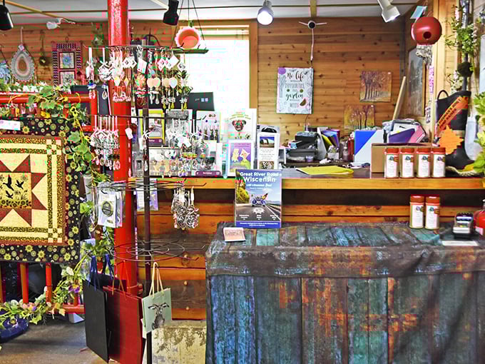 A checkout counter that feels like the warm heart of the barn. Wood, metal, and quilts create a rustic symphony that HGTV designers try desperately to replicate.