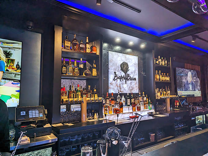 Behind this bar, bottles aren't just inventory—they're promises. The Bake'n Bacon logo glows like a beacon for the flavor-famished.