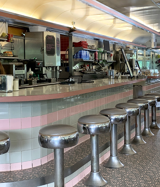The counter—where solo diners become regulars, where you can watch short-order ballet in action, and where coffee refills appear almost telepathically.
