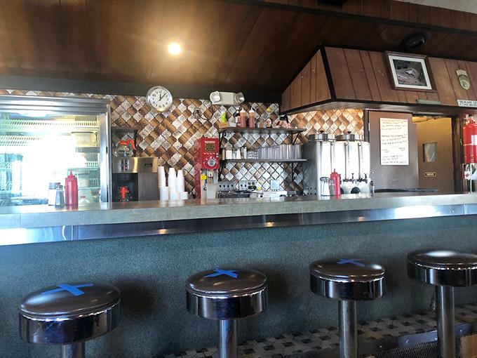 The counter view—where breakfast theater unfolds daily with short-order cooks as the unsung heroes of morning happiness.