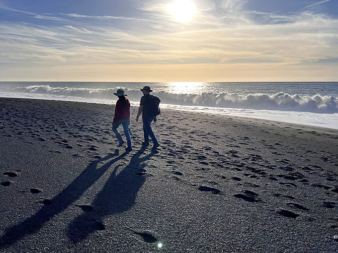 Silhouettes against the setting sun create living art on nature's darkest canvas—romance doesn't get more cinematic than this.