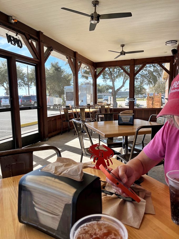 The screened patio offers Florida dining without the Florida bugs. That red crab-shaped napkin holder is just showing off.