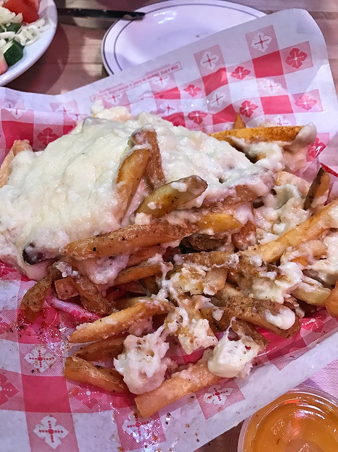 Crab fries smothered in cheese—because sometimes French fries need to dress up fancy and show the entrées who's boss.