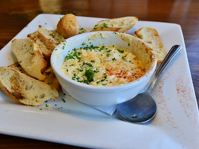 This bubbling crab dip isn't just appetizing—it's hypnotizing. Watching the cheese pull as you dip that garlic toast should be a spectator sport.