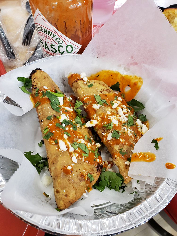 These aren't just tacos—they're crispy vessels of joy, topped with hot sauce, cilantro, and cheese that make your taste buds throw a spontaneous fiesta.