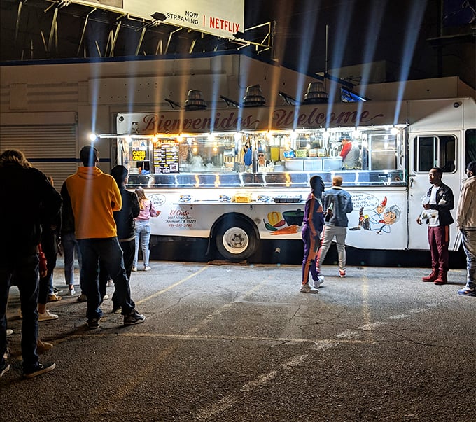 The nighttime glow of El Chato isn't just light—it's a beacon drawing hungry souls from across the city like culinary moths.