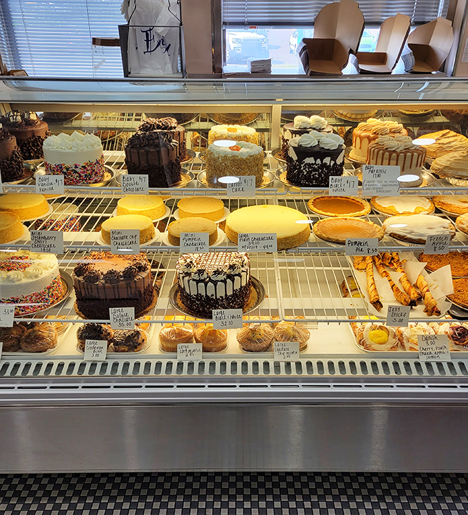 The dessert case that's essentially an adult candy store—where "I'll just look" becomes "I'll take one of each" faster than you can say "diet starts tomorrow."