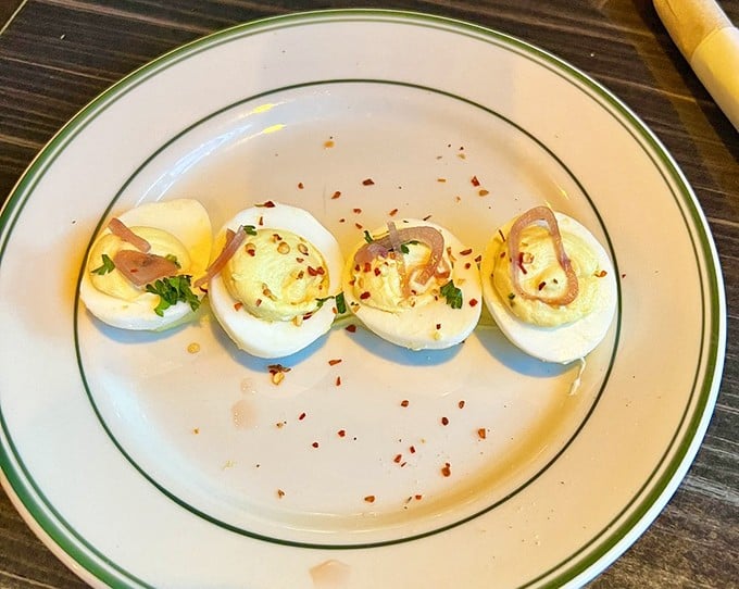 Deviled eggs – the little black dress of appetizers – dolled up with red pepper flakes and herbs. Grandma's classic recipe went to art school and came back fabulous.