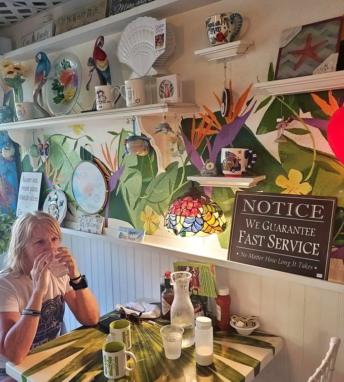 Where coastal kitsch meets breakfast bliss. That humorous sign promising "fast service no matter how long it takes" says it all.