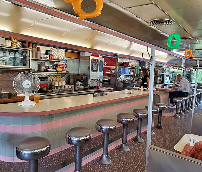 The counter is where the magic happens—where coffee refills appear mysteriously and the griddle symphony plays all day long.