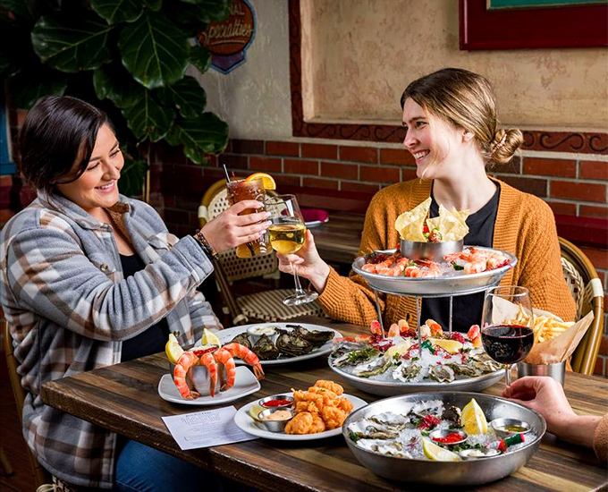 Seafood brings people together – a feast of oysters, shrimp, and shared plates that turns strangers into friends and meals into memories.