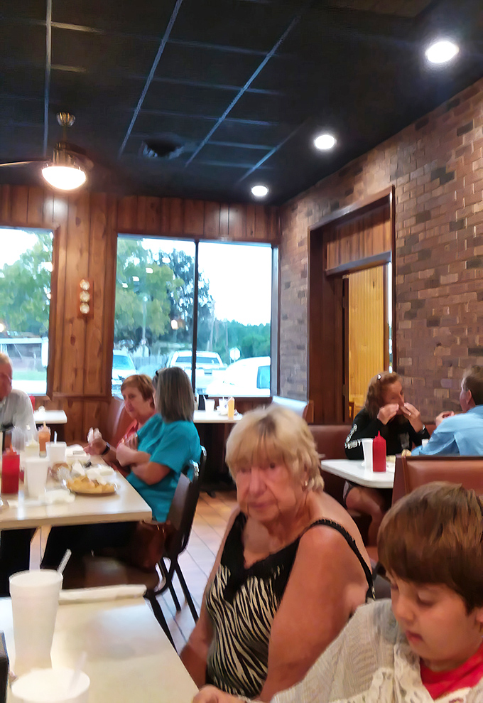 The dining room hums with the soundtrack of community—forks against plates, laughter, and conversations that matter more than whatever's happening on your phone.
