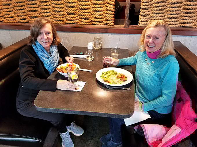 Happy diners sharing that "we made the right choice" smile. The universal language of good food bringing people together.