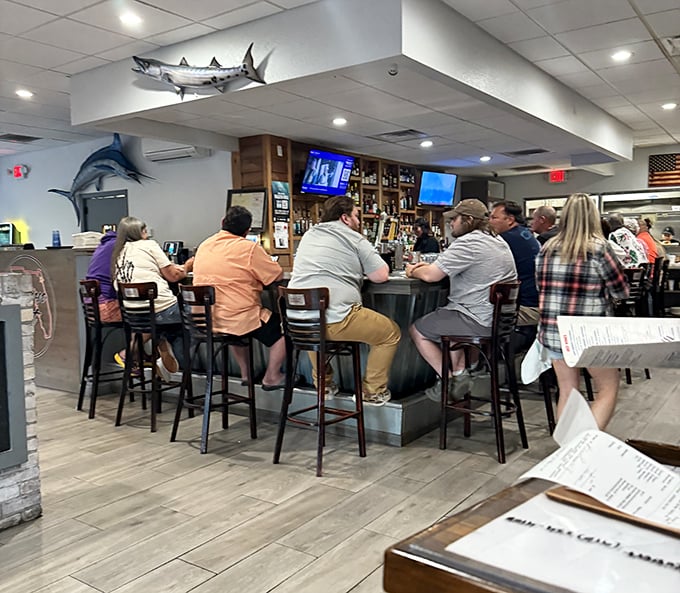 The bar area buzzes with locals who've discovered what you just did – this place knows its seafood.