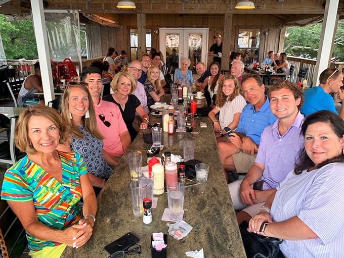The true measure of a local gem: tables filled with multi-generational families making memories over seafood that's fresher than most of the jokes they're telling. 