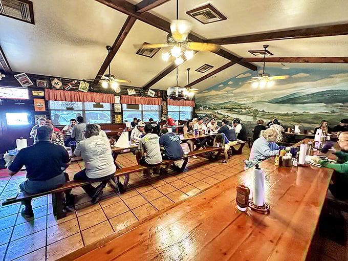 The communal dining experience at its finest—strangers united by wooden benches and the universal language of "pass the sauce, please."