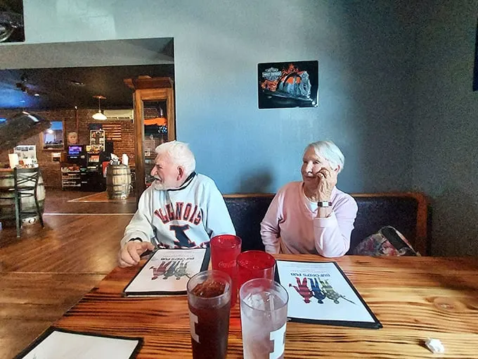 The true heart of Buford's: regulars sharing stories over comfort food, creating the soundtrack every great small-town restaurant needs.
