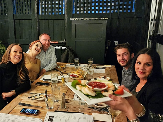 The true measure of a great restaurant: happy faces around the table, sharing seafood and stories. Memory-making in progress.