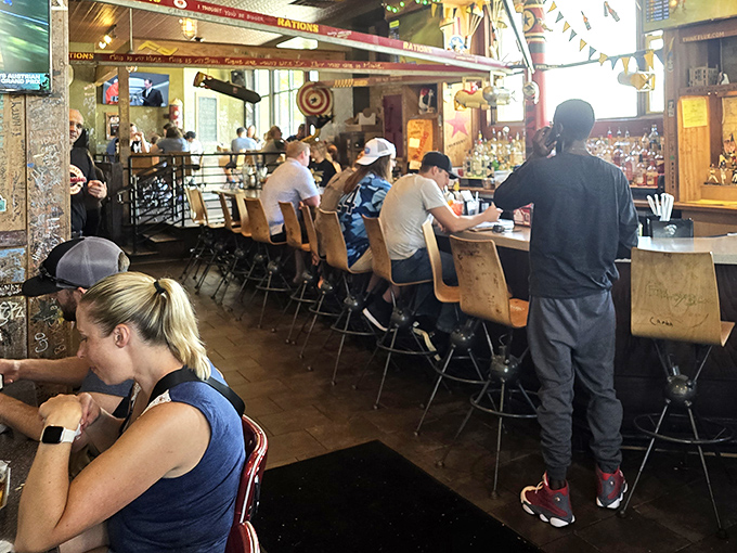 The bar at AJ Bombers: where strangers become friends, friends become family, and everyone becomes united in the universal language of "pass the ketchup."