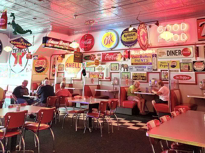 The dining room hums with conversation under the watchful gaze of vintage advertising, where strangers become neighbors and calories don't count.